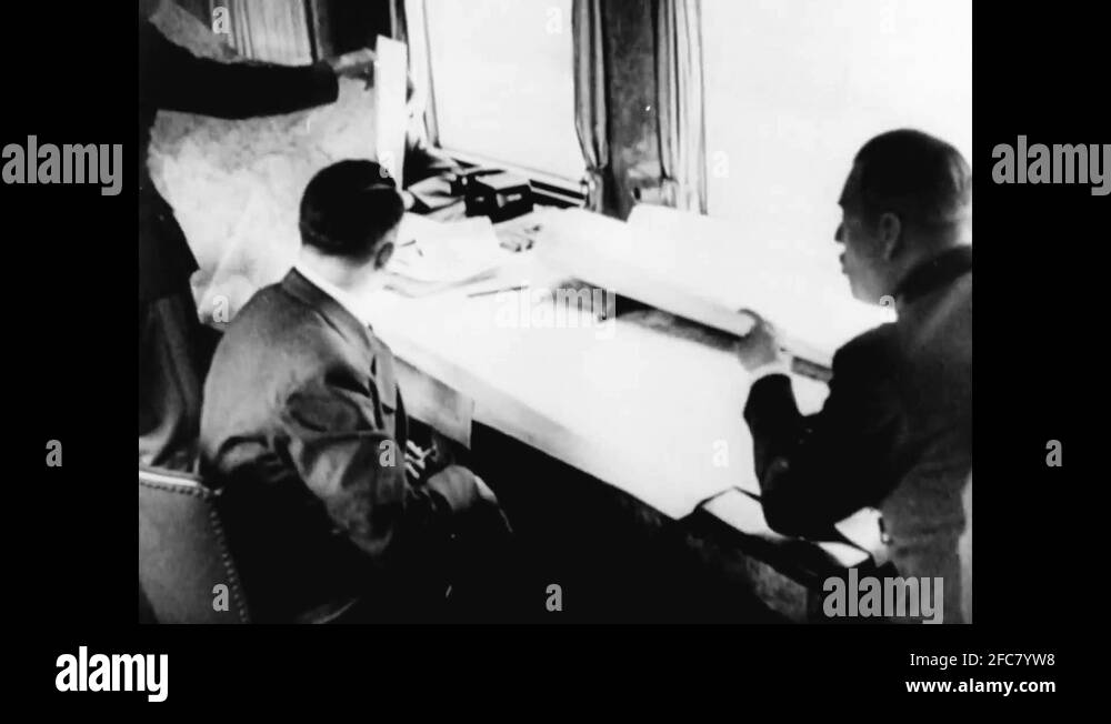 WW2 - Adolf Hitler sit at a table with maps in front of him Stock Video ...