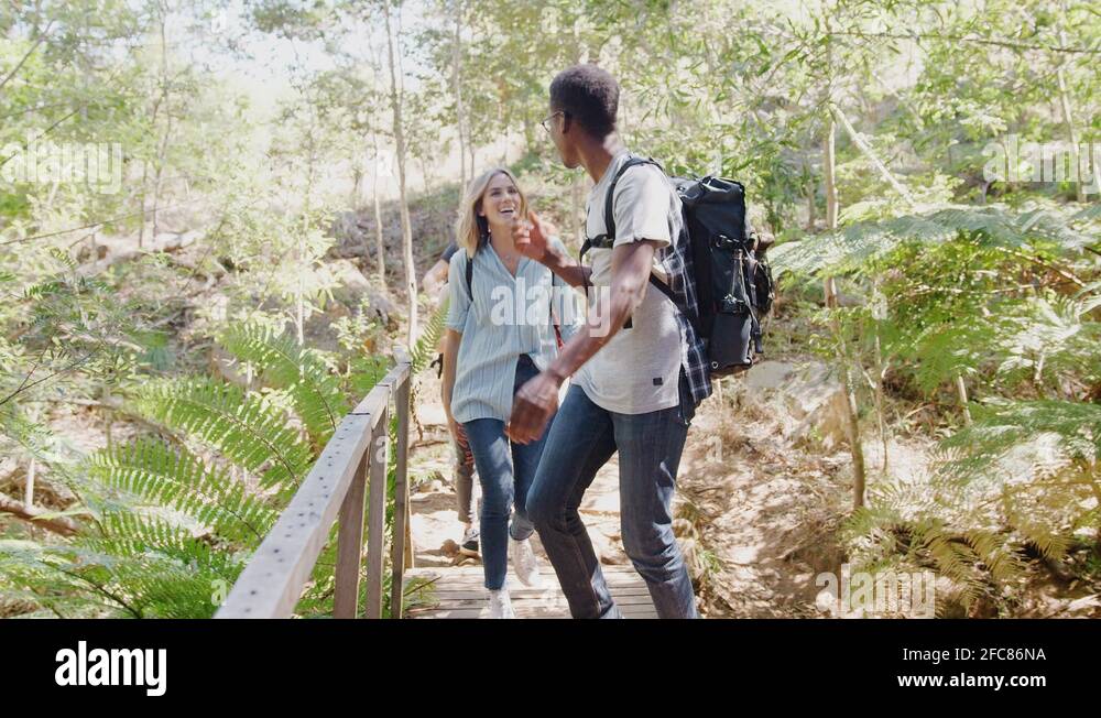 Smiling friends crossing road Stock Videos & Footage - HD and 4K Video ...