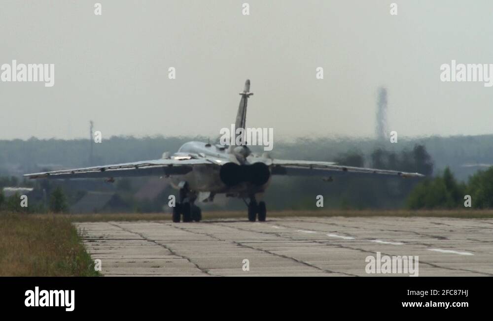 Sukhoi Su-24 (NATO r: Fencer) Aircraft with bombs moves to runway for ...