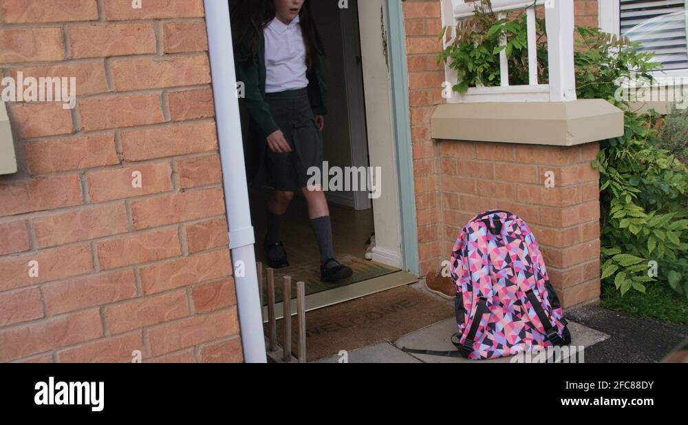 School girl rushing out the front door and off to school Stock Video ...