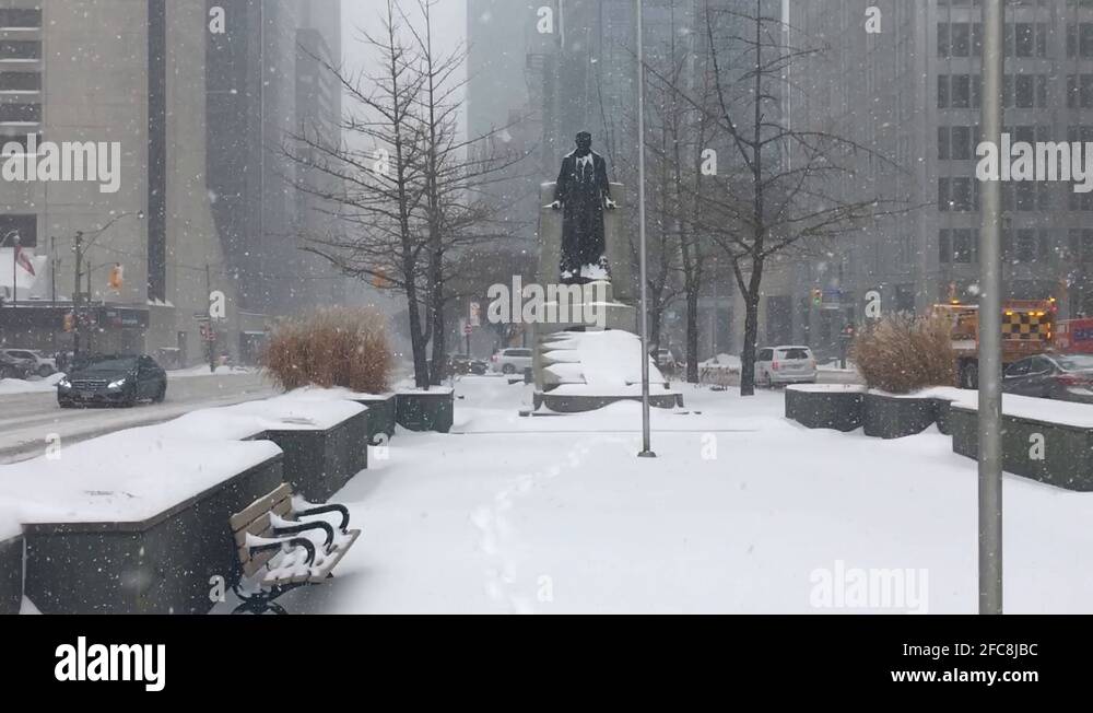 Snow covers Sir Adam Beck Monument during snowstorm, Toronto Stock ...