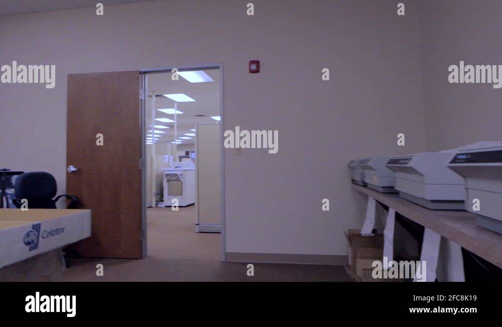 Dot matrix printers inside a standard cubicle style office Stock Video ...