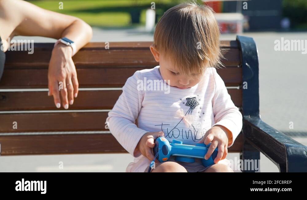 Little girl bench Stock Videos & Footage - HD and 4K Video Clips - Alamy