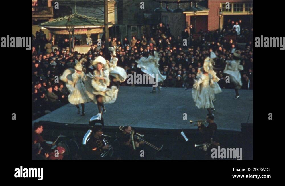 1930s: UNITED STATES: cancan dancers on outdoor stage by Chinatown café ...