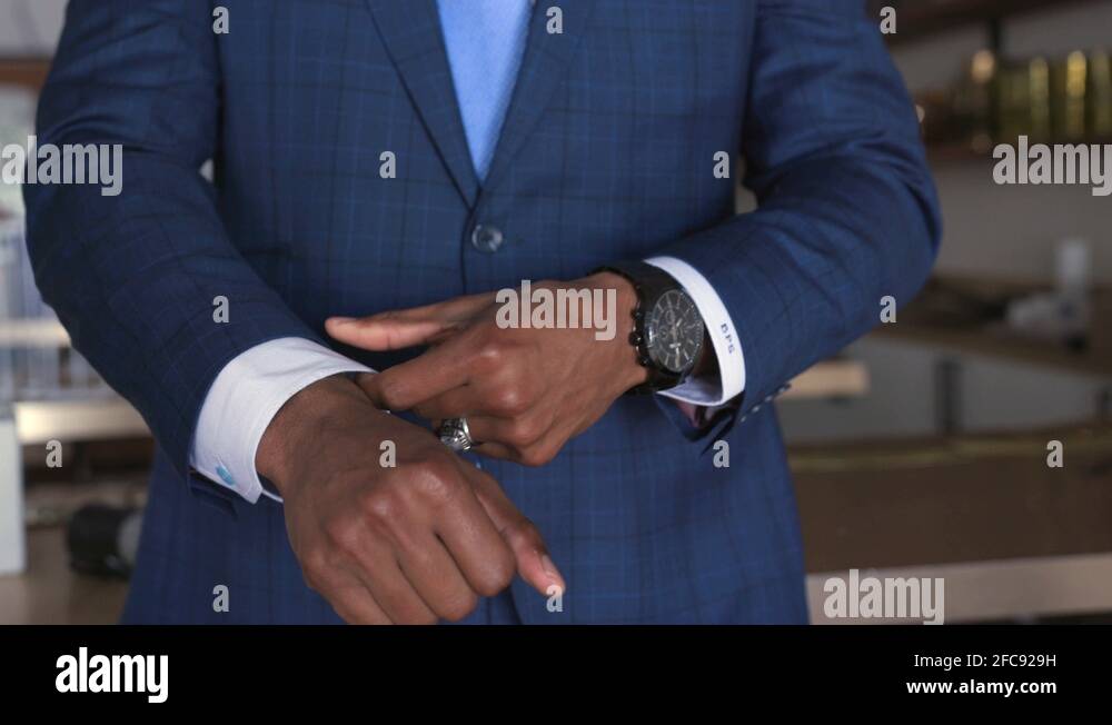 Man adjusting cuffs Stock Videos & Footage - HD and 4K Video Clips - Alamy
