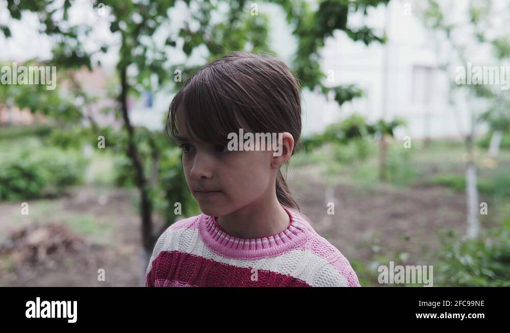 Face portrait close up. Beautiful little girl looking at the camera ...