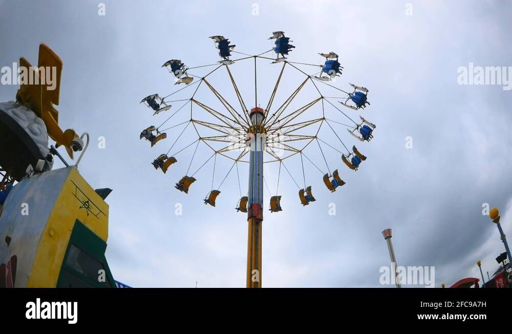 Spinning swings ride at an amusement park/circus/carnival Stock Video ...