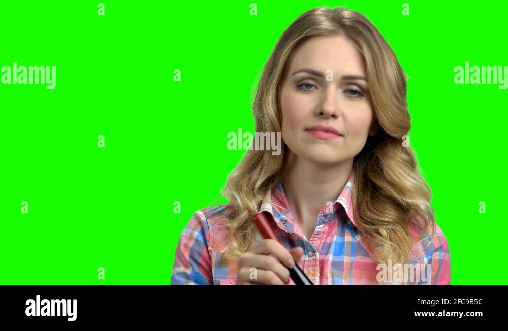 Cute girl doing makeup on green screen Stock Video Footage - Alamy