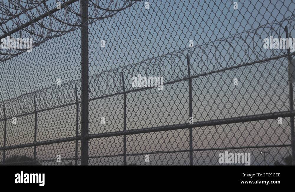 Prison Fences with Razor Wire Looking Through 4K Stock Video Footage ...