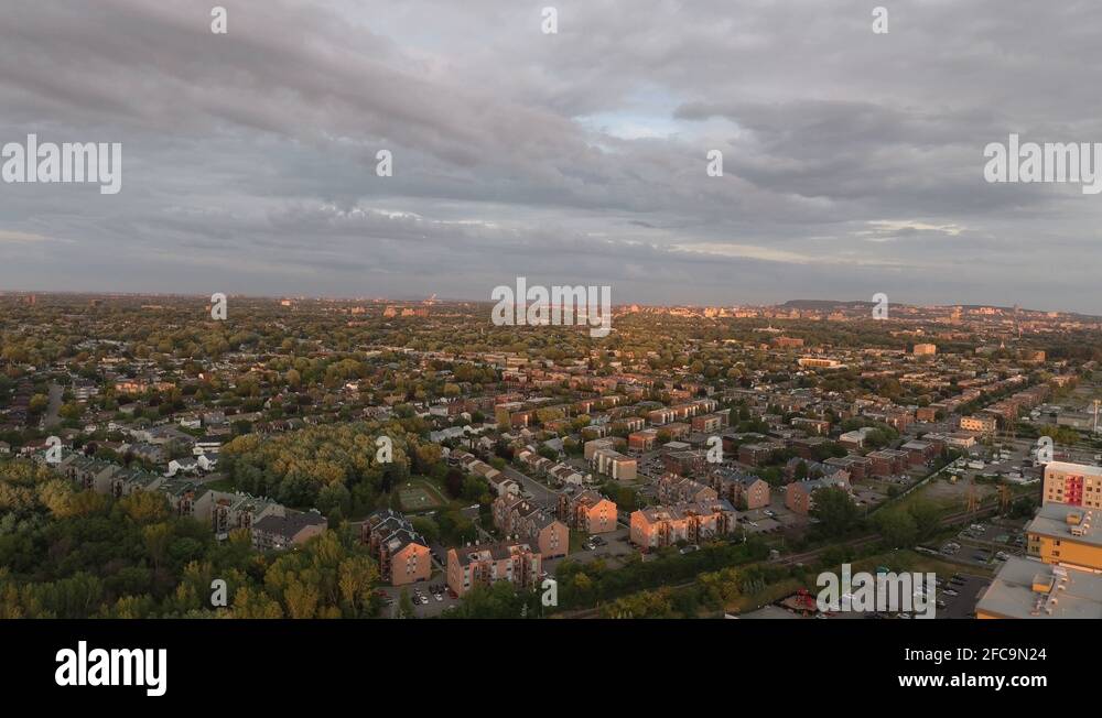 Last rays of the sun shining onto residential neighborhood with pretty ...