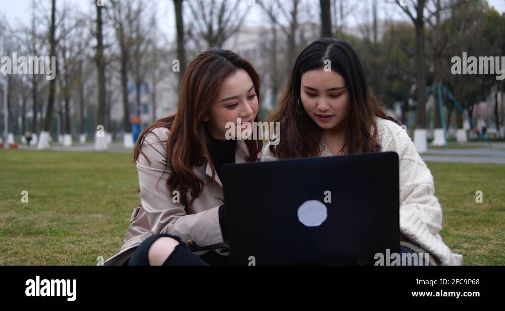 two young girls using computer browsing information Stock Video Footage ...