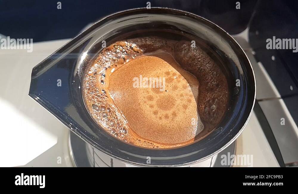 Slowmotion of a boiling coffee. Process of making good turkish coffee ...