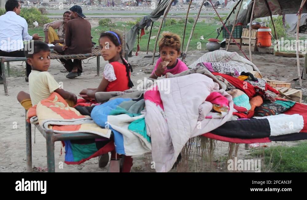 Three Children Sit Together In The Slums Of Pakistan Stock Video ...