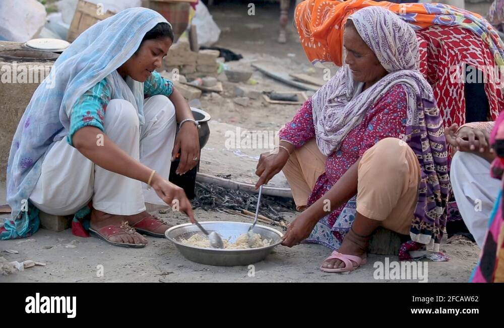 Closeup Of Two Women Preparing Traditional Cuisine In The Slums Stock ...