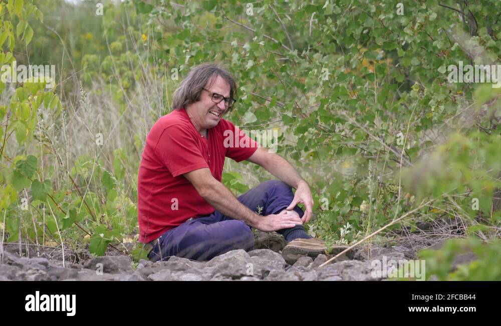 Man Fallen on the Ground With Foot Pain Outdoors Stock Video Footage ...