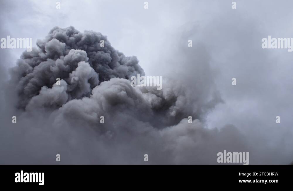 Volcano eruption with smoke in the air Stock Video Footage - Alamy