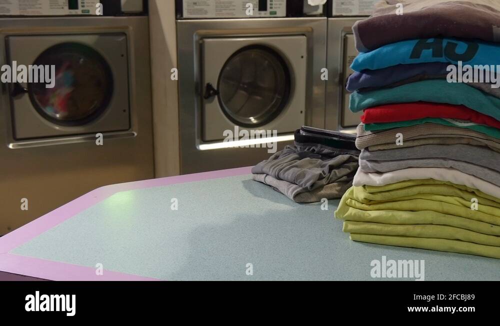 Clothes folded counter Stock Videos & Footage - HD and 4K Video Clips ...