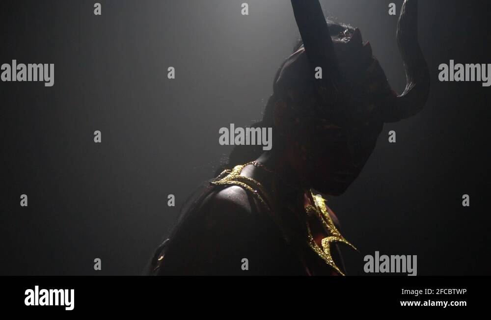 Light turns on when a female demon looks at the camera with her red ...