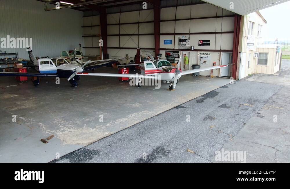 General aviation propeller airplanes in hangar, aircraft repair and ...