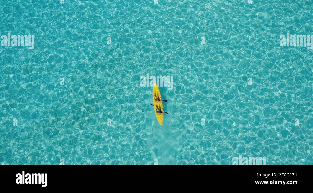 Kayaking together in a perfect blue lagoon Stock Video Footage - Alamy