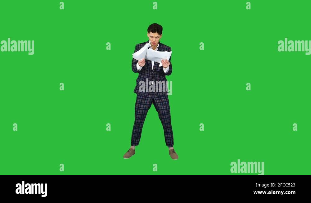 Businessman throwing papers in the air and dancing on a Green Screen ...