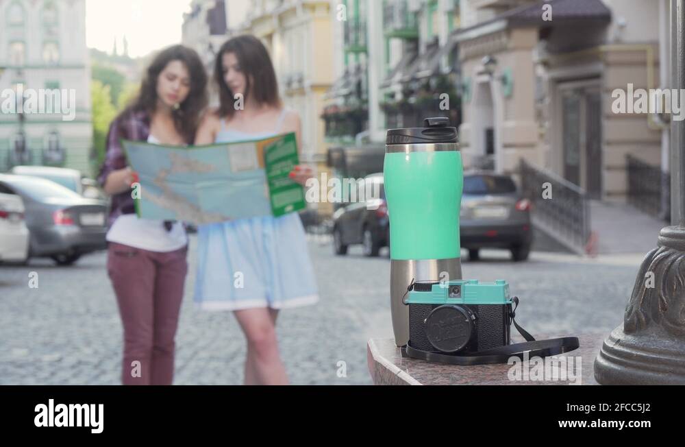 Two women with map Stock Videos & Footage - HD and 4K Video Clips - Alamy