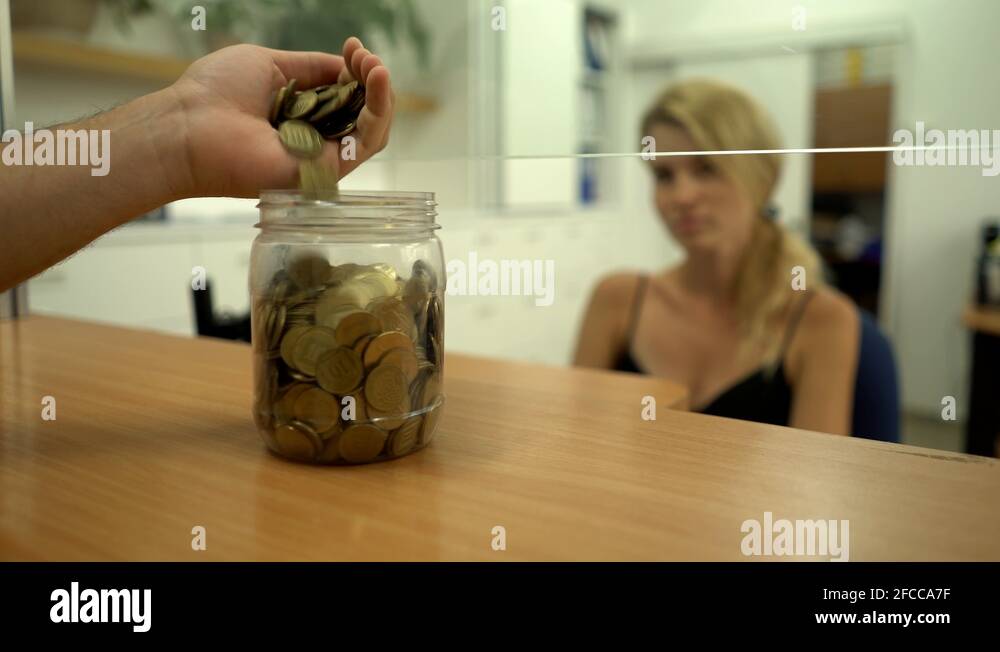 Glass with coins Stock Videos & Footage - HD and 4K Video Clips - Alamy