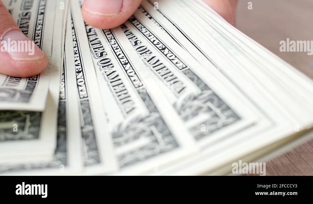 Person counting dollar banknotes in hands. Stitch of money. Rich man ...