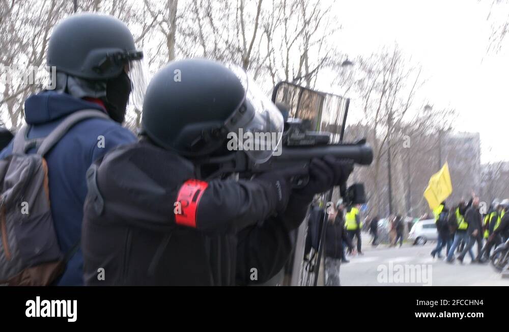 French Police Officer Points Grenade Launcher Stock Video Footage - Alamy