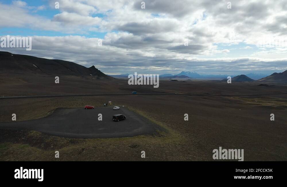 Camper van and cars parked at remote Icelandic highland rest area ...