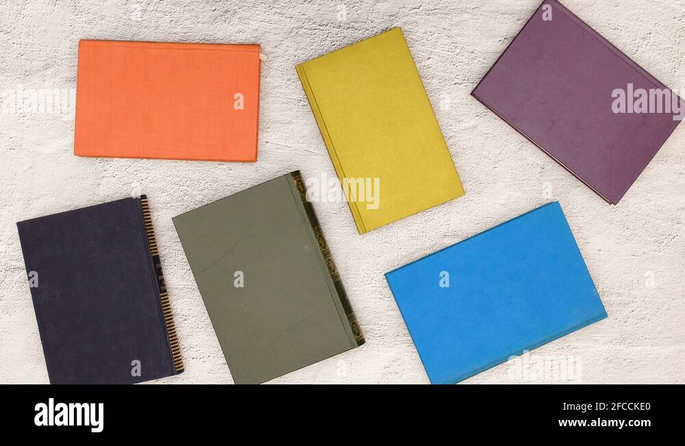 Stop motion animation of colorful books changing quickly on white ...