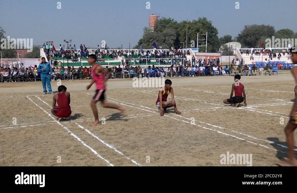 Boys playing kho kho, a traditional Indian game. Opposing players enter ...