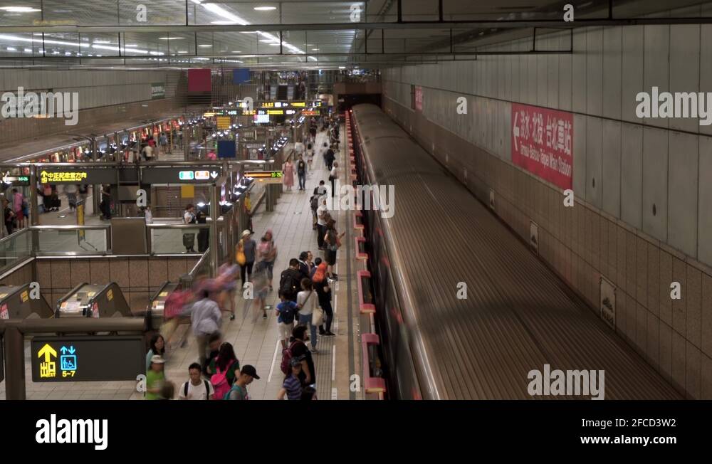 4K Timelapse birds eye view of rush hour in metro/subway station with ...