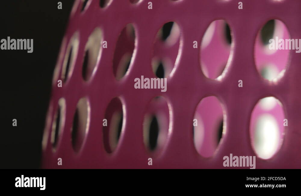 spinning lilac sphere with holes and backlight, background Stock Video ...