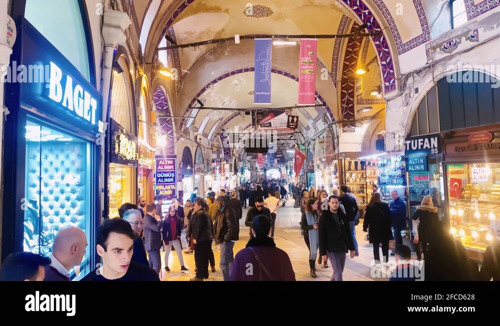 People walking and window shopping in an indoor bazaar in Istanbul ...