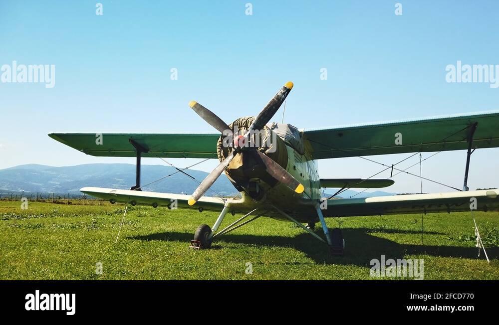 Russian Antonov An-2 on grass airfield, vintage Soviet propeller ...