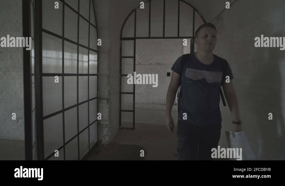 A scary ghost of a fat woman with a rusty cage on his head and with ...