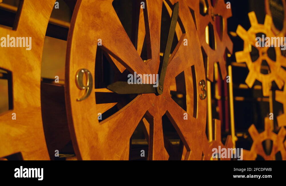 Huge wooden gears. Increased clock mechanism. A rotating gear Stock ...