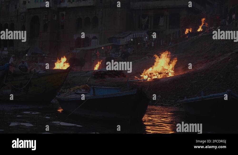 Boat In The Ganges River Viewing The Famous Cremation Burning Ceremony ...