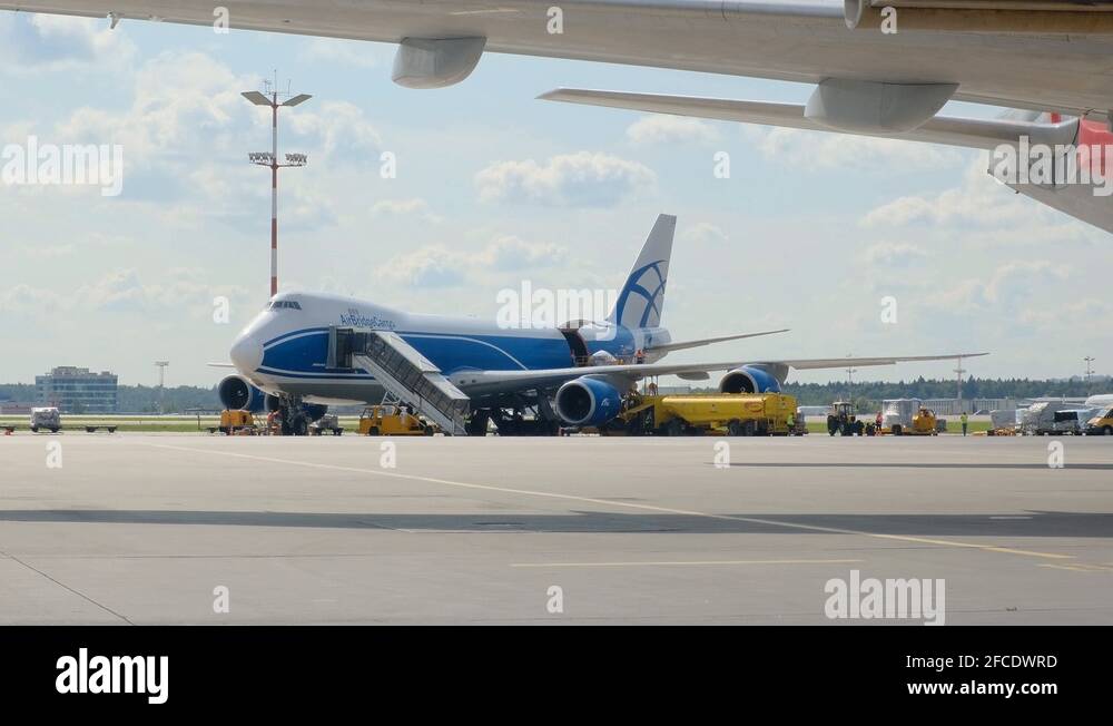 Ground handling of large cargo airplane Boeing 747 of ABC - Air Bridge ...