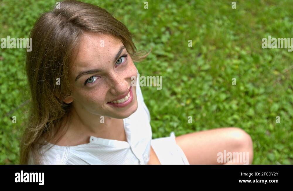 Young girl sitting facing camera Stock Videos & Footage - HD and 4K ...