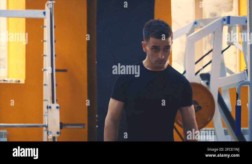 Young sports guy. Look at your muscular shape and its reflection in the ...