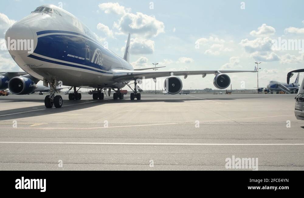 Ground handling of large cargo airplane Boeing 747 of ABC - Air Bridge ...