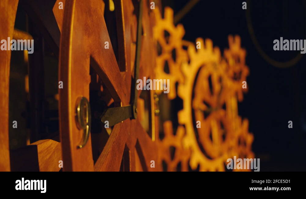 A lot of rotating wooden gears in a huge clock mechanism Stock Video ...