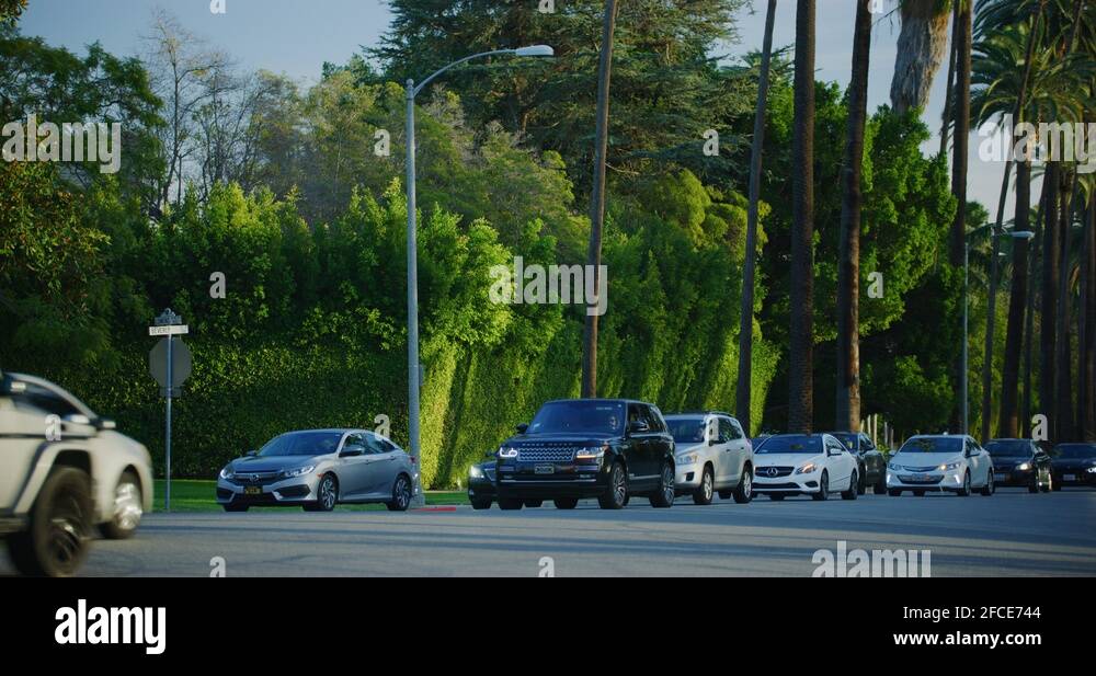 Traffic at the famous 6-way stop street intersection in Beverly Hills ...