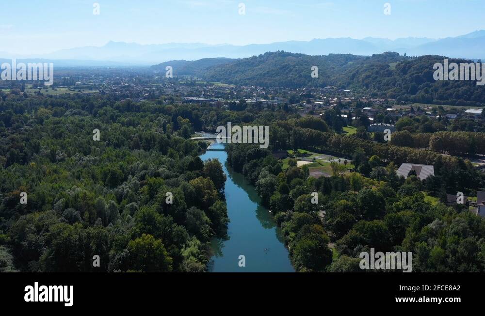 River Gave de Pau France aerial view Pyrenees in background Gelos ...