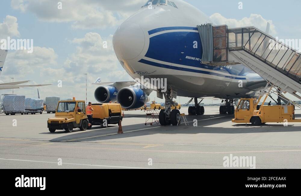 Ground handling of large cargo airplane Boeing 747 of ABC - Air Bridge ...