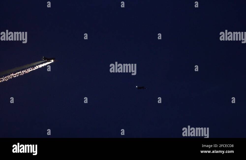 Stunt planes in a night show with pyrotechnics effects Stock Video ...