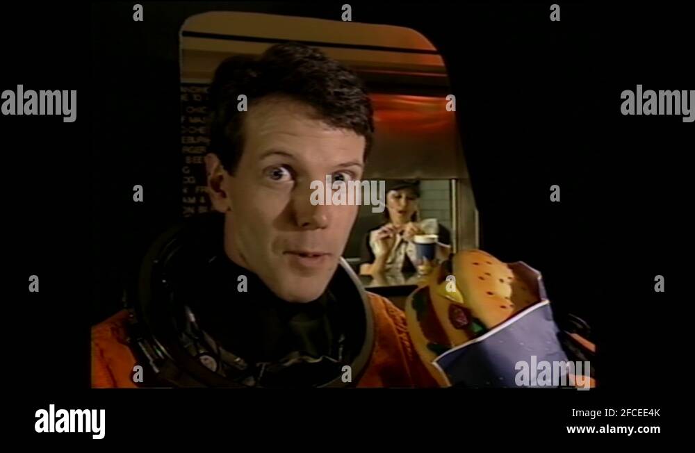 2000s: Man sits in Space Shuttle at takeout window of restaurant ...