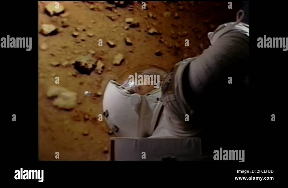 2000s: Astronaut in space suit trains in airplane in zero gravity. Man ...
